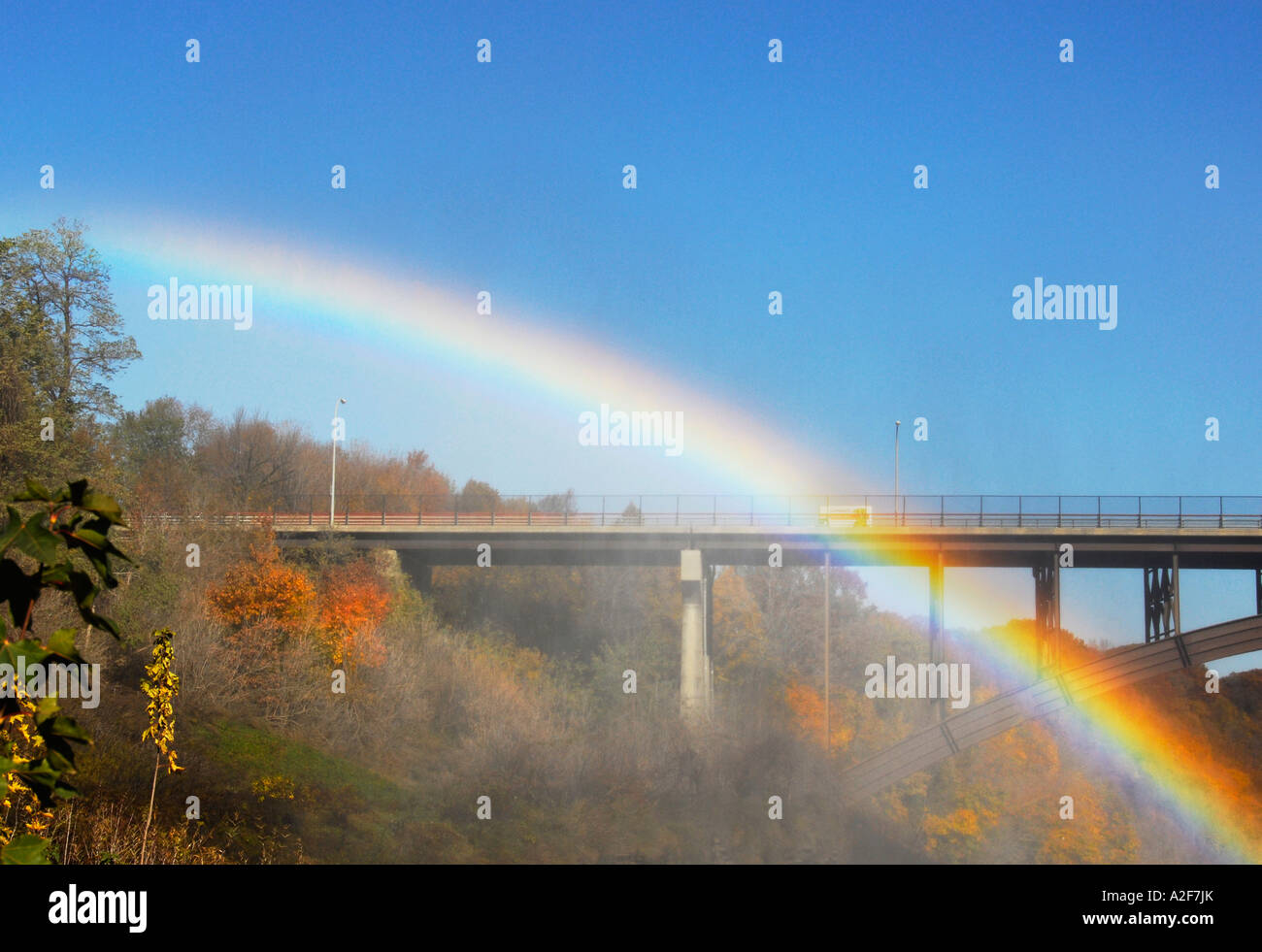 Rainbow and bridge Stock Photo - Alamy
