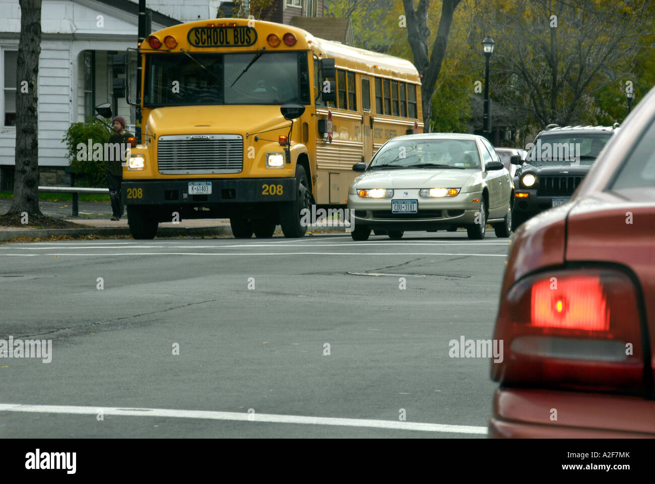 Schoolbus at street crossing Stock Photo - Alamy