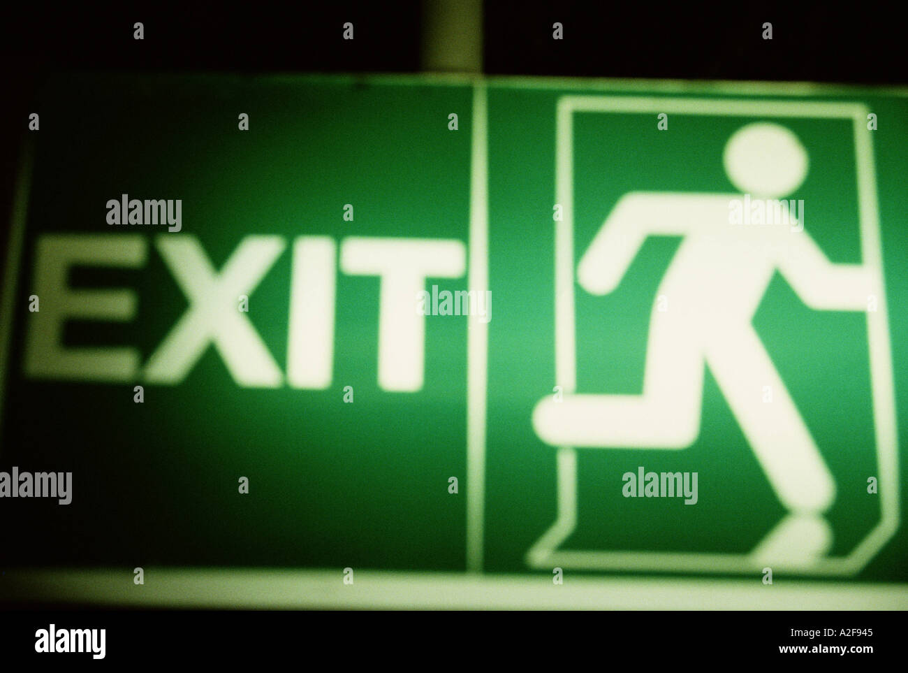 Green lit emergency exit sign hi-res stock photography and images - Alamy