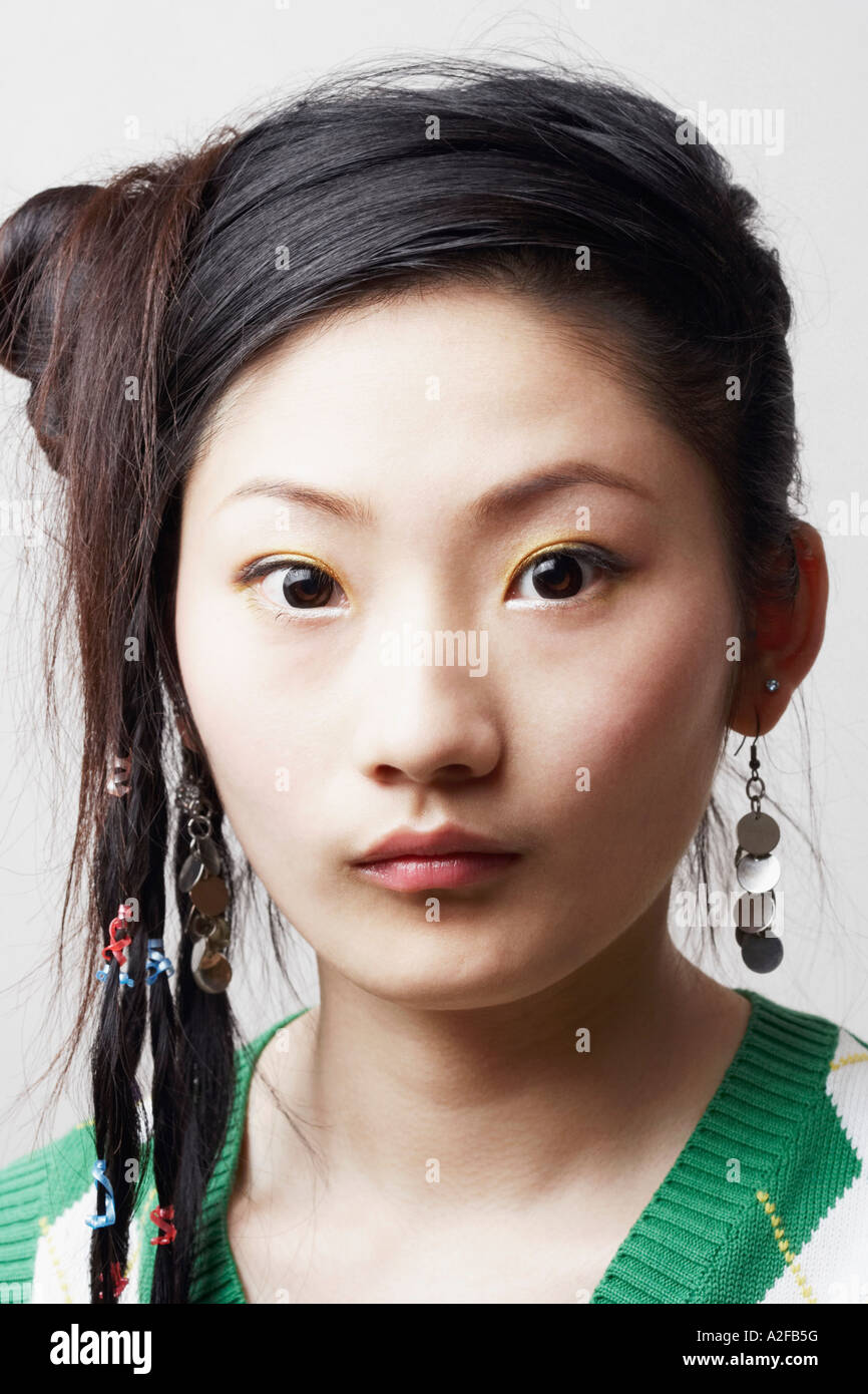 Portrait of a young woman looking serious Stock Photo - Alamy