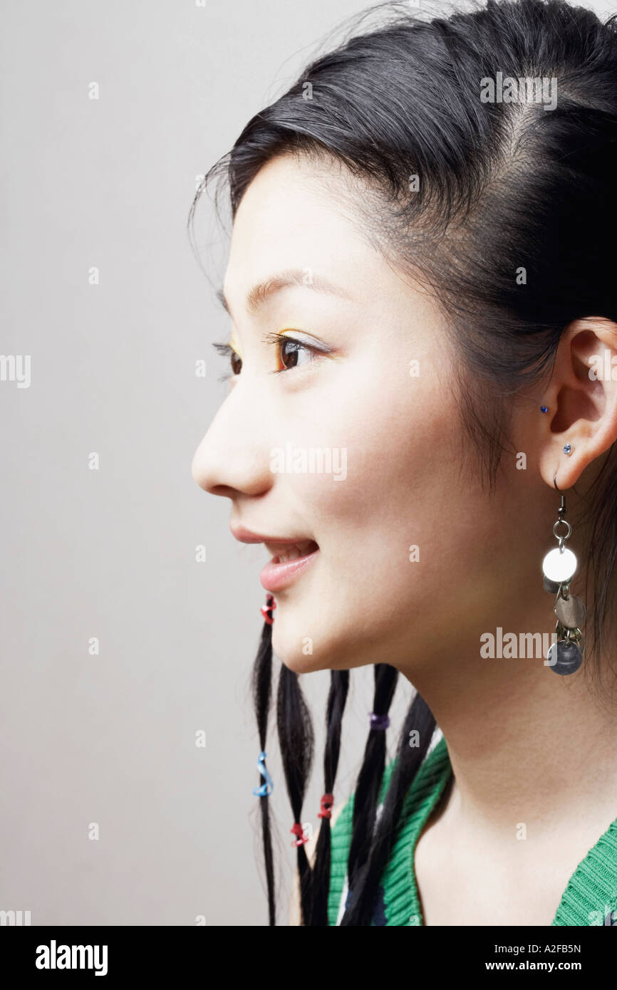 Side profile of a young woman smiling Stock Photo - Alamy