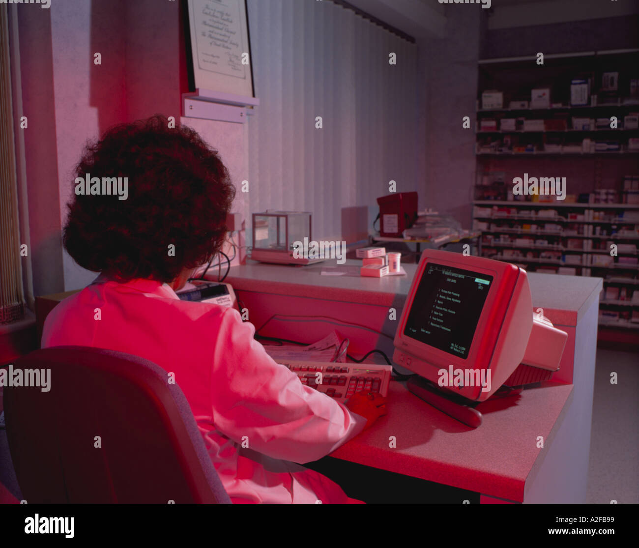 Pharmacist using a computer in a hospital pharmacy Stock Photo - Alamy