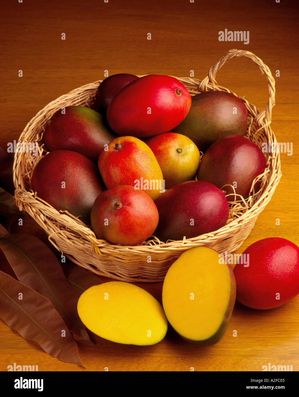 mangoes in basket in studio Stock Photo - Alamy