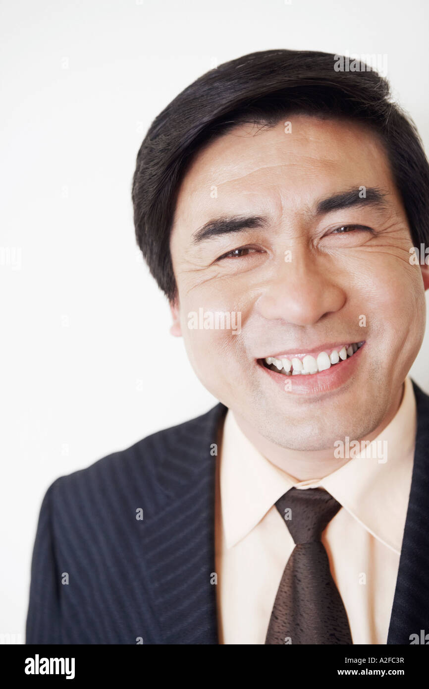 Portrait of a businessman smiling Stock Photo - Alamy