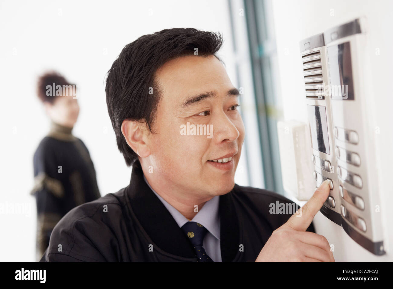 Happy chinese man smiling using hi-res stock photography and images - Alamy