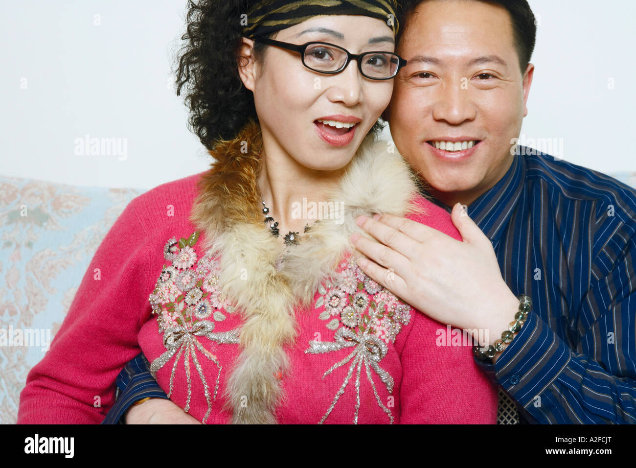 Two females sitting down hugging hi-res stock photography and images ...