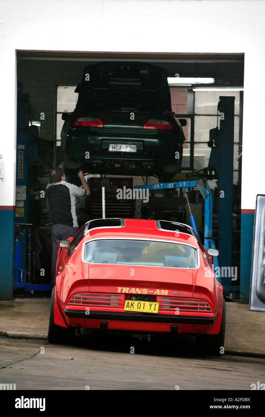 A red Pontiac Trans Am car waits for a mechanical service Stock Photo ...
