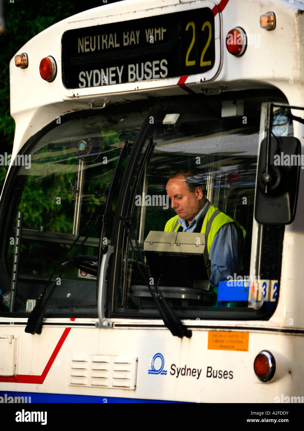 Bus driver at the wheel of his public transport vehicle in Sydney ...
