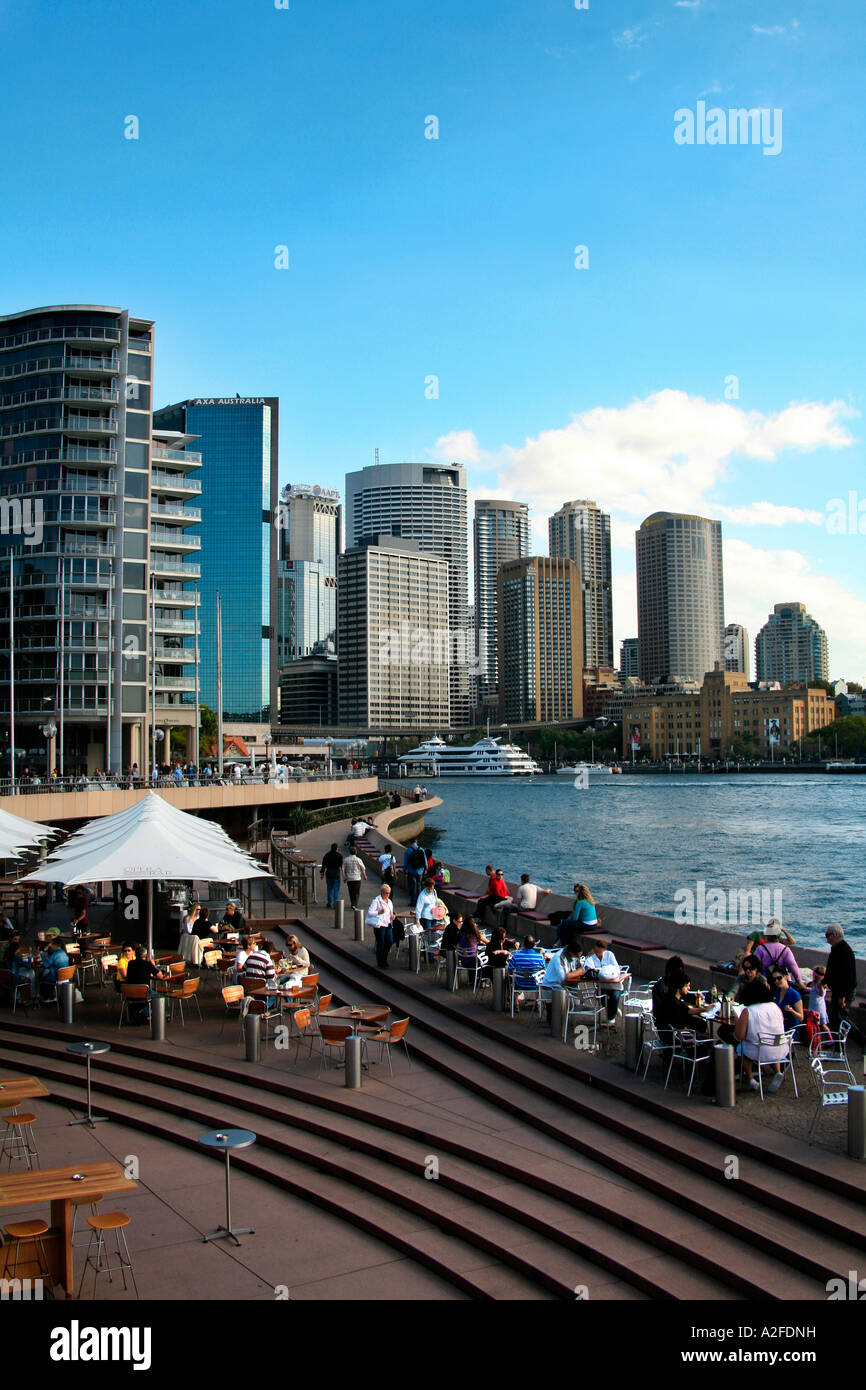 Sydney's circular quay with Opera Bar in foreground as patrons gather ...