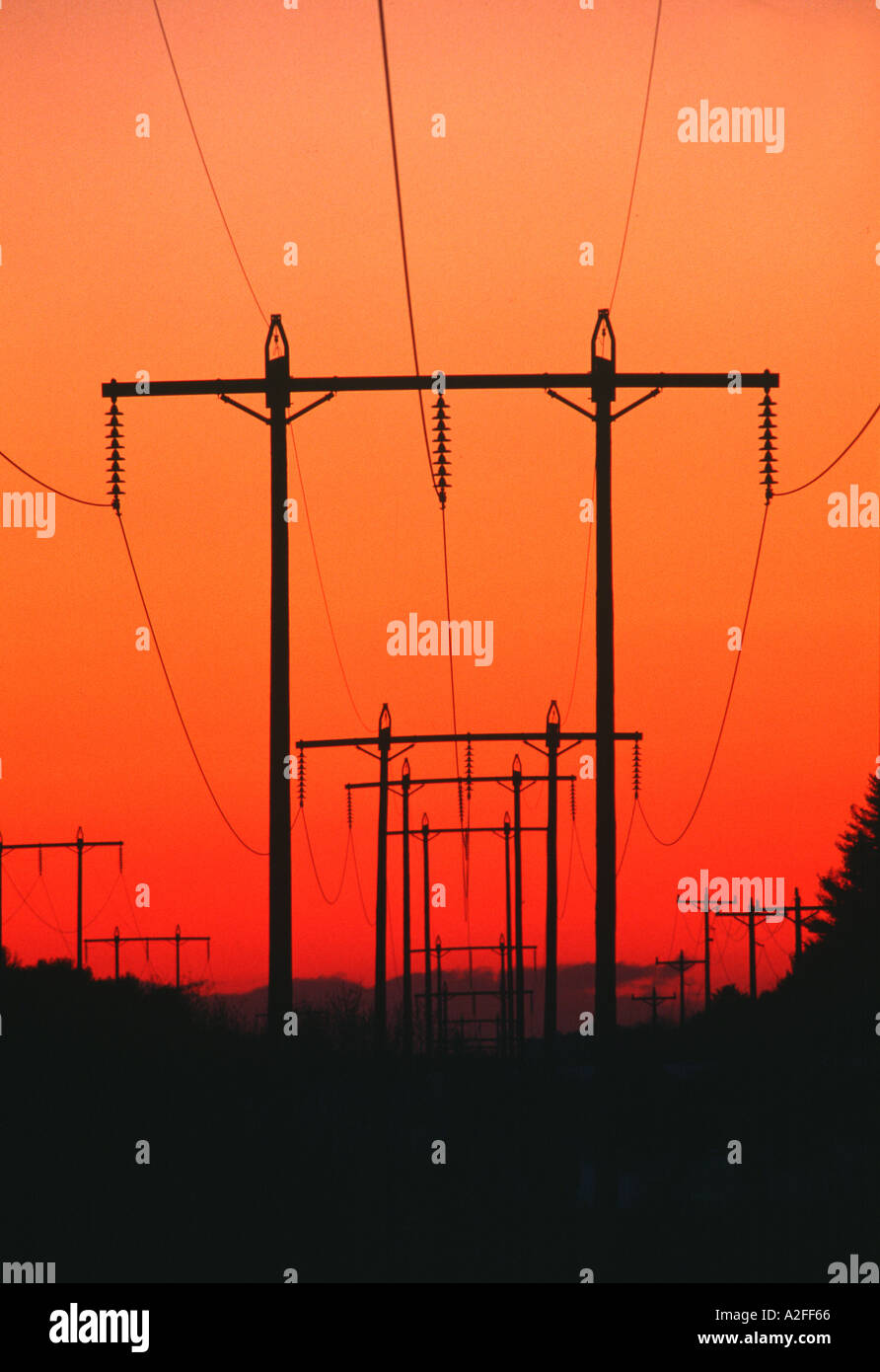 A blood red sun rises sets over high tension power lines in Rockingham ...