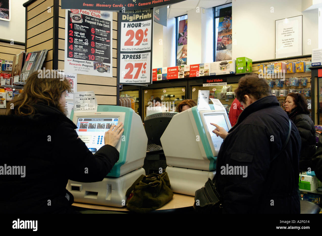 Customers at Ritz Camera print their digital camera photos at the ...