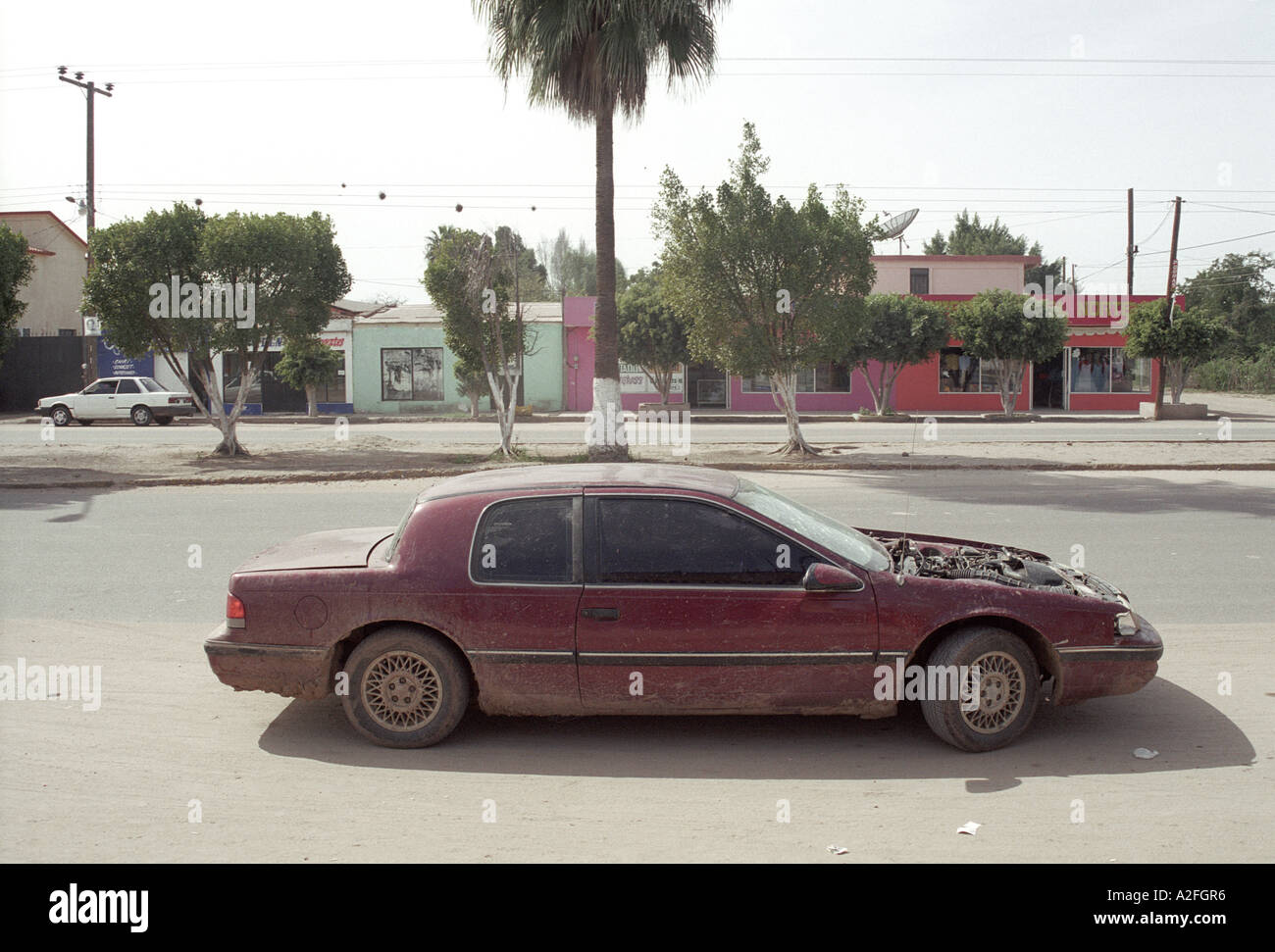 Burgundy/Maroon car without bonnet in small town Mexico, Baja ...