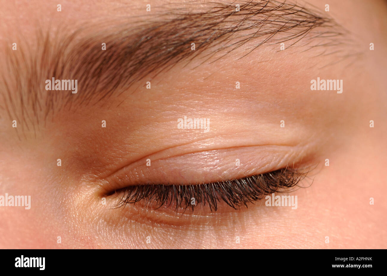 Woman's eye closed, close-up Stock Photo - Alamy