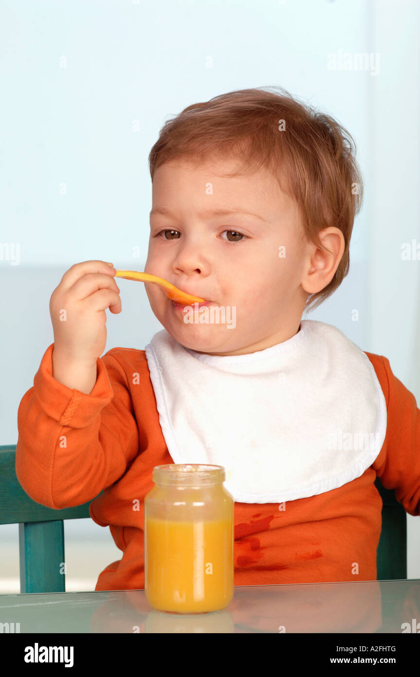 Little child eating Stock Photo - Alamy