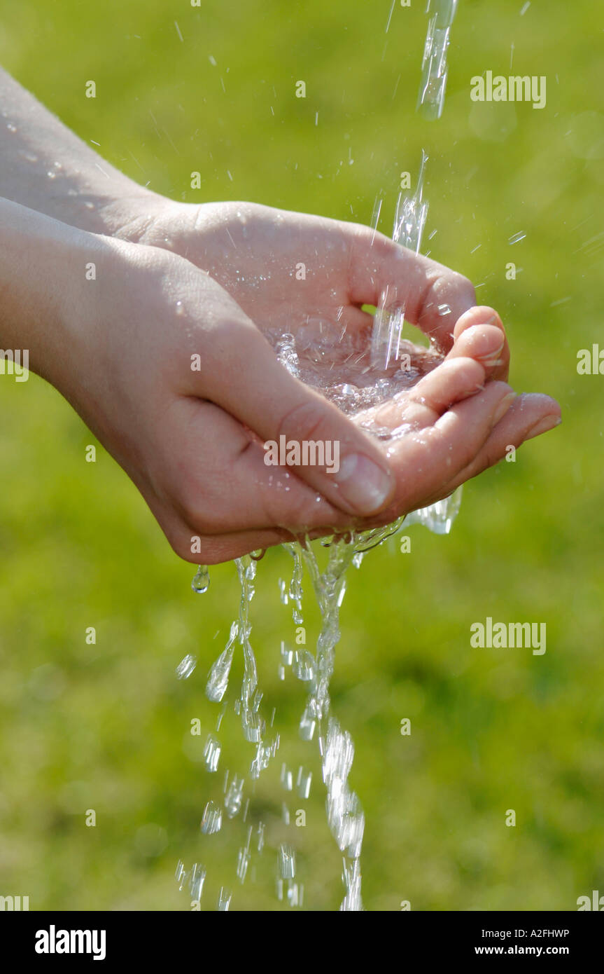 Person holding hand under water, close-up Stock Photo - Alamy