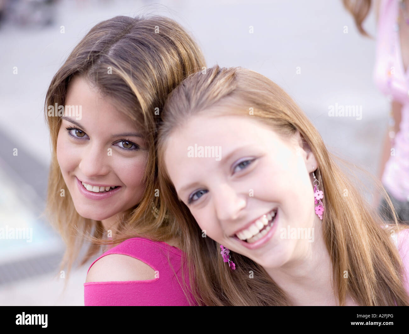 Two teenage girls (16-17) smiling Stock Photo - Alamy