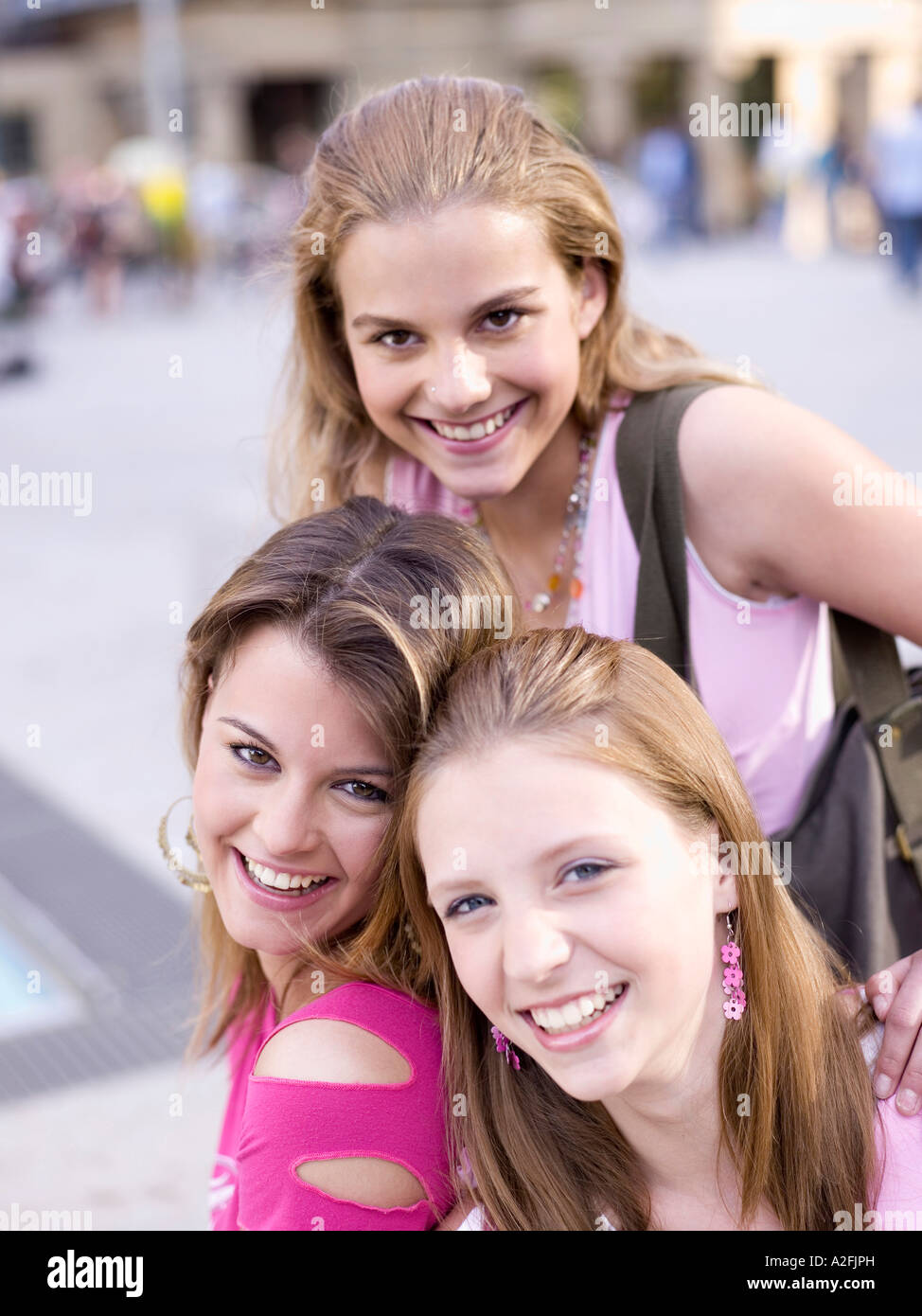 Three teenage girls (16-17) smiling Stock Photo - Alamy