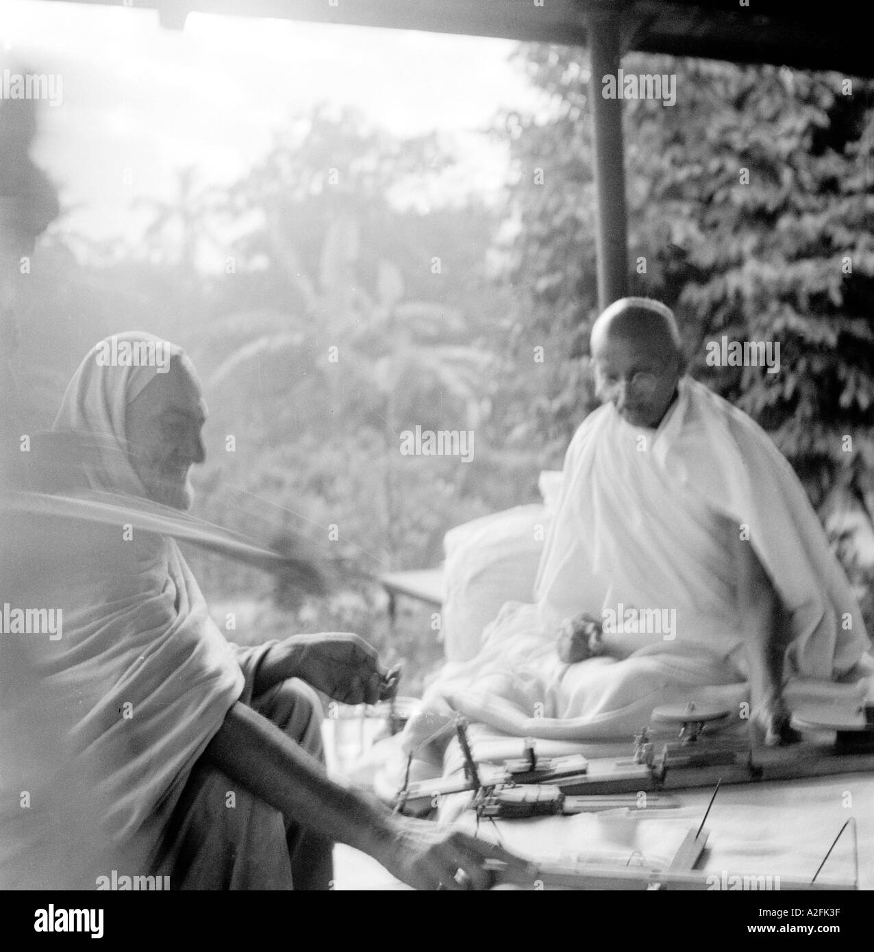 MKG33531 Mahatma Gandhi spinning sitting talking with Khan Abdul Gaffar ...