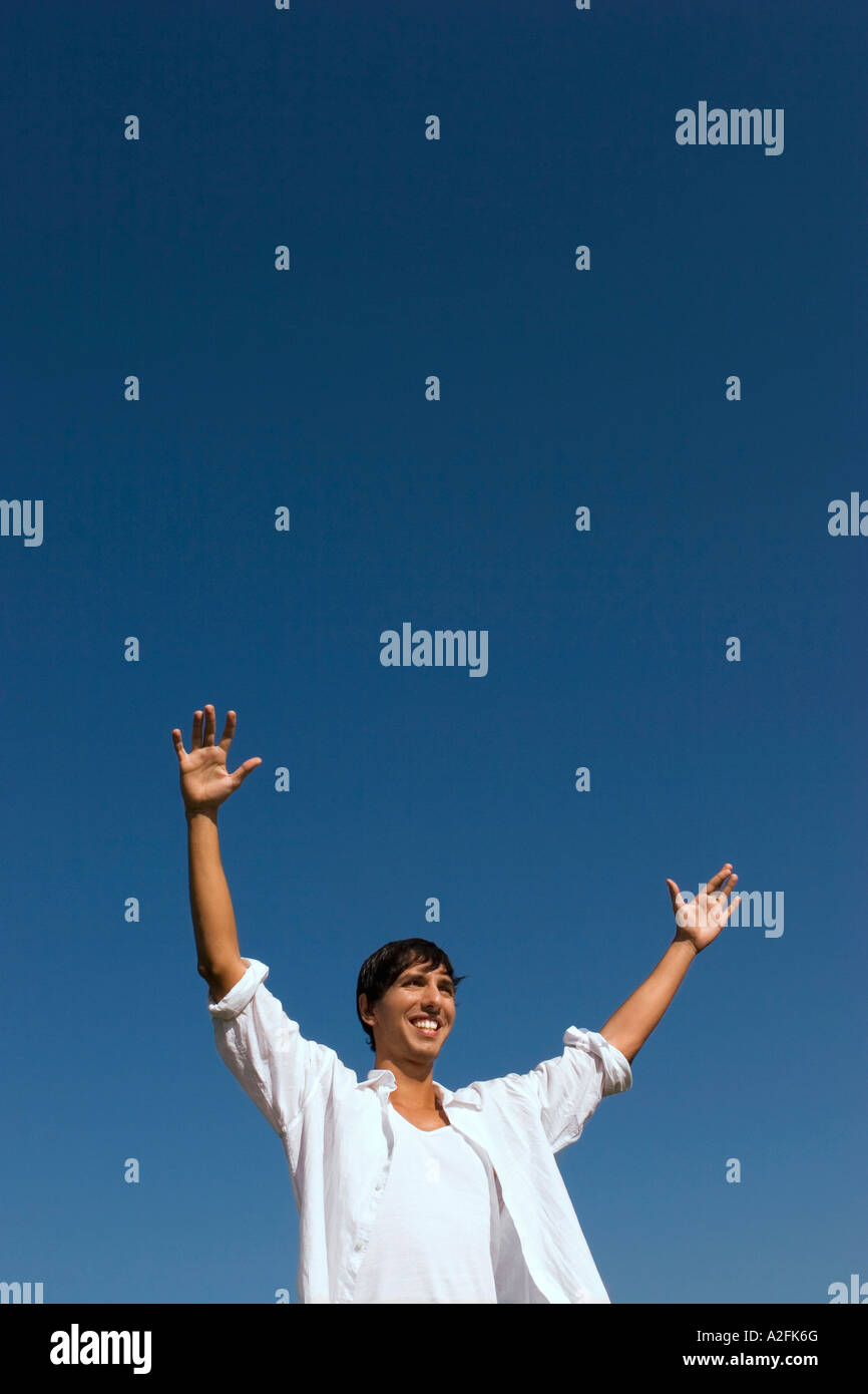 Young man, smiling, arms outstretched Stock Photo - Alamy