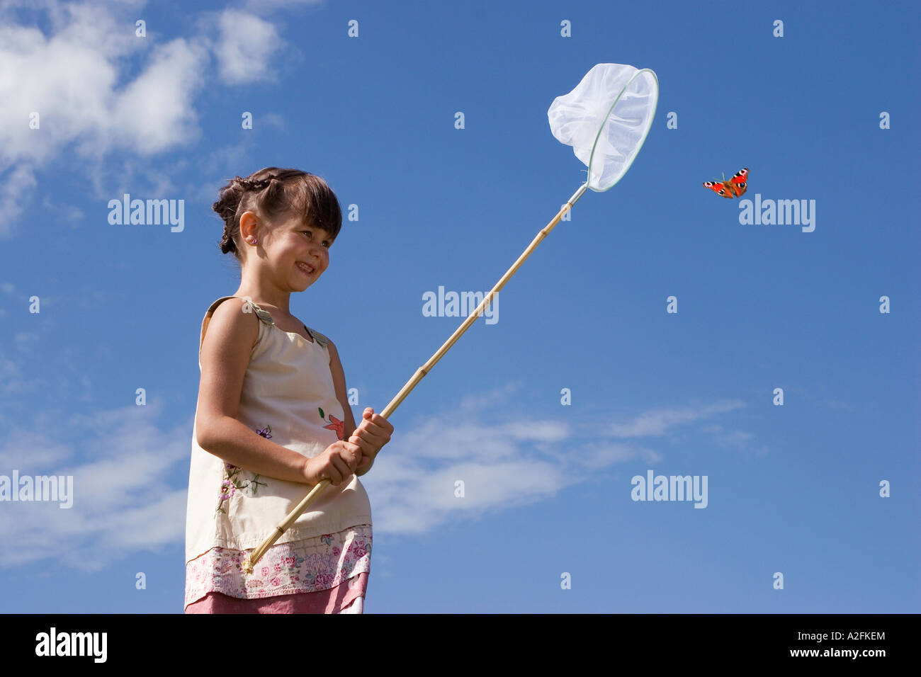 Girls catching butterflies butterfly hi-res stock photography and ...
