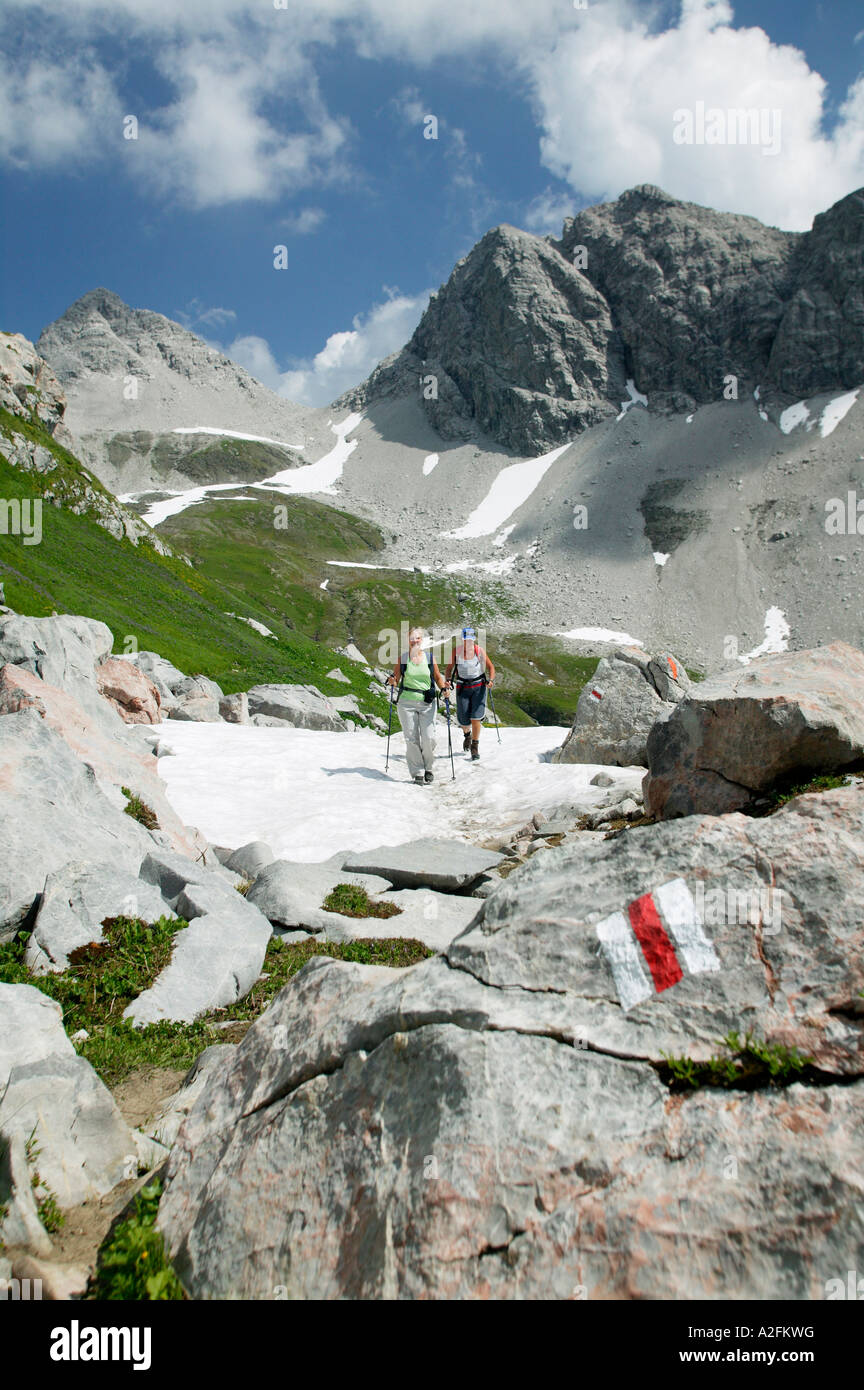 Two people hiking in austrian alps Stock Photo - Alamy