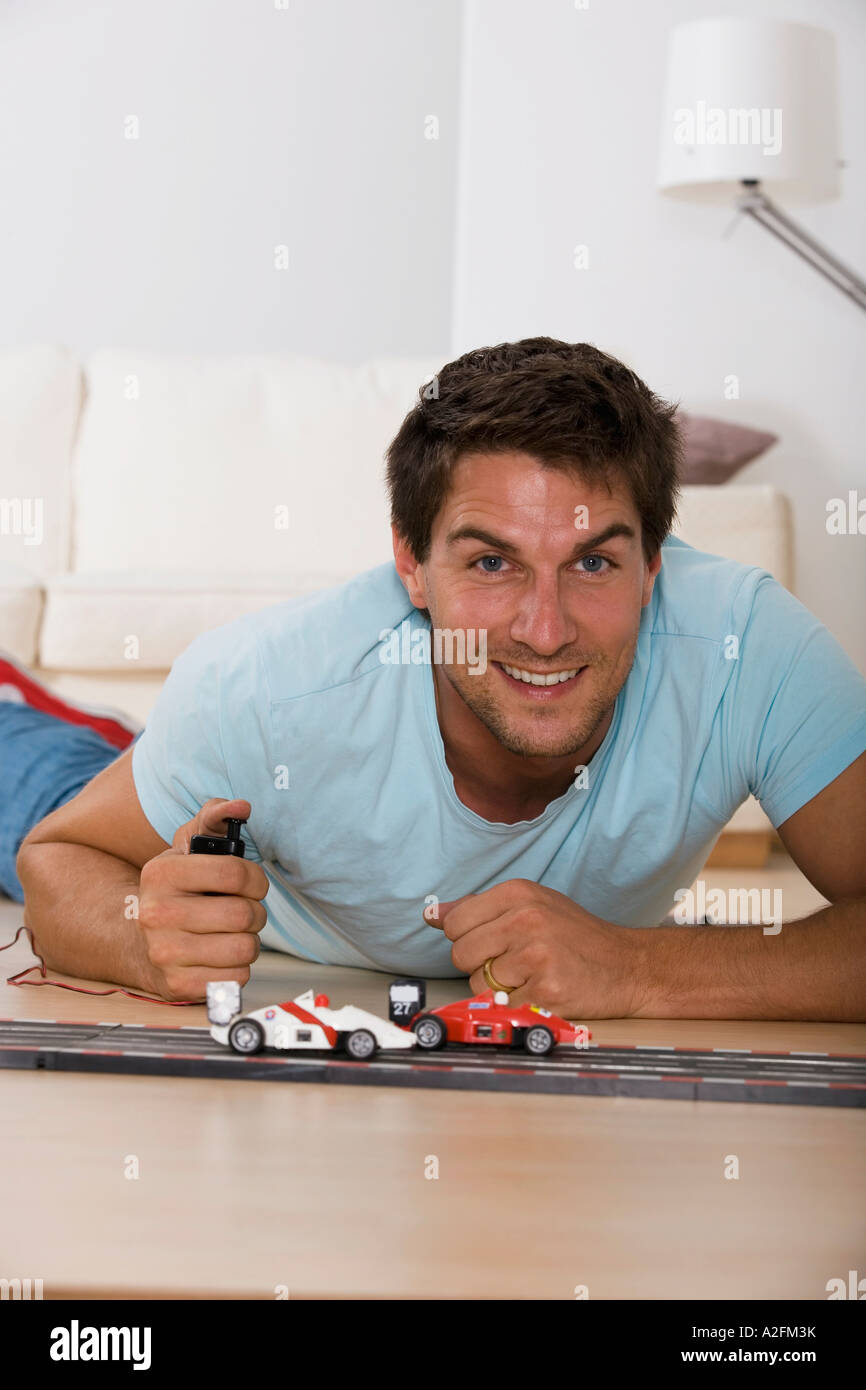 Man playing with toy cars Stock Photo - Alamy