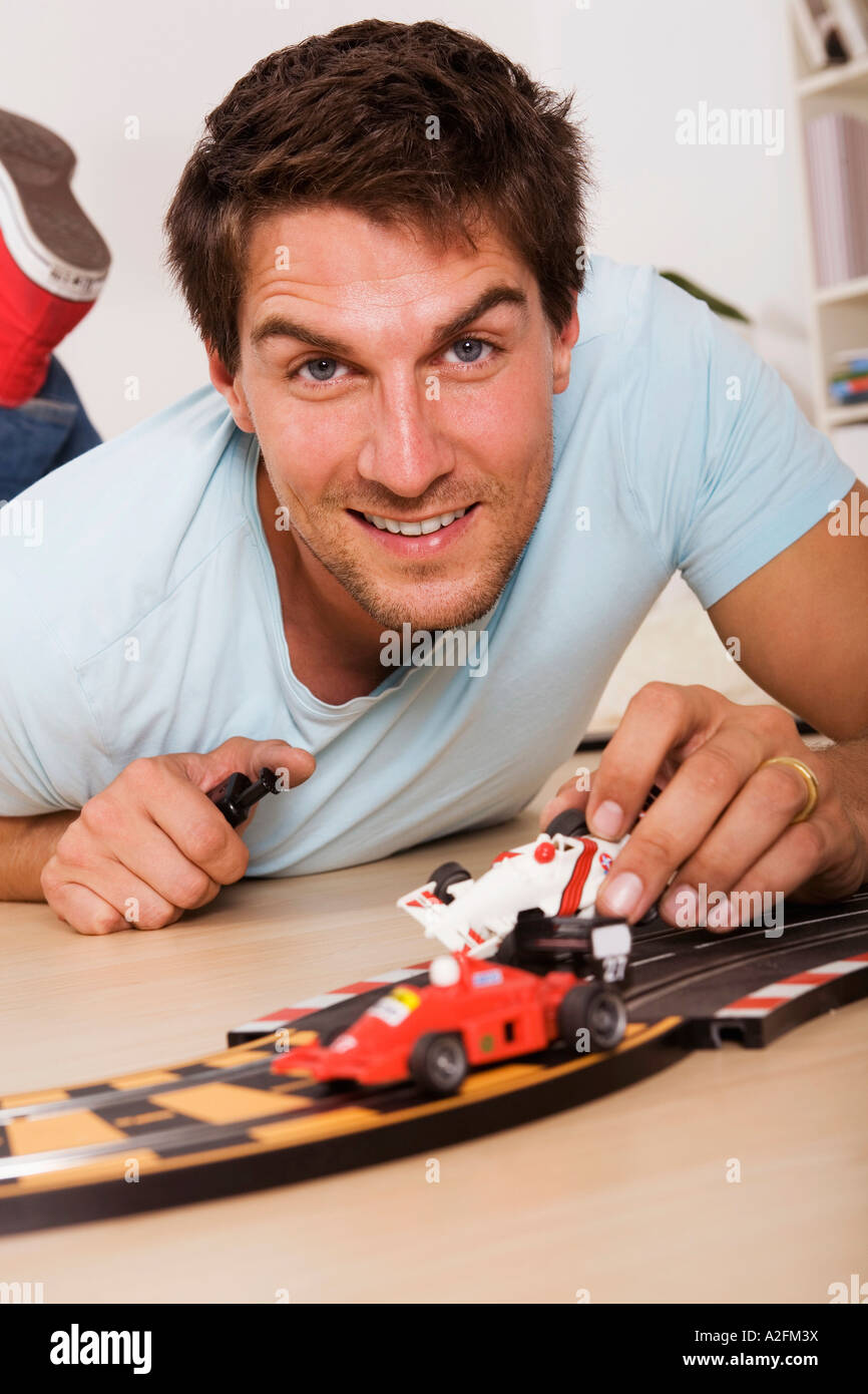 Man playing with toy cars Stock Photo - Alamy
