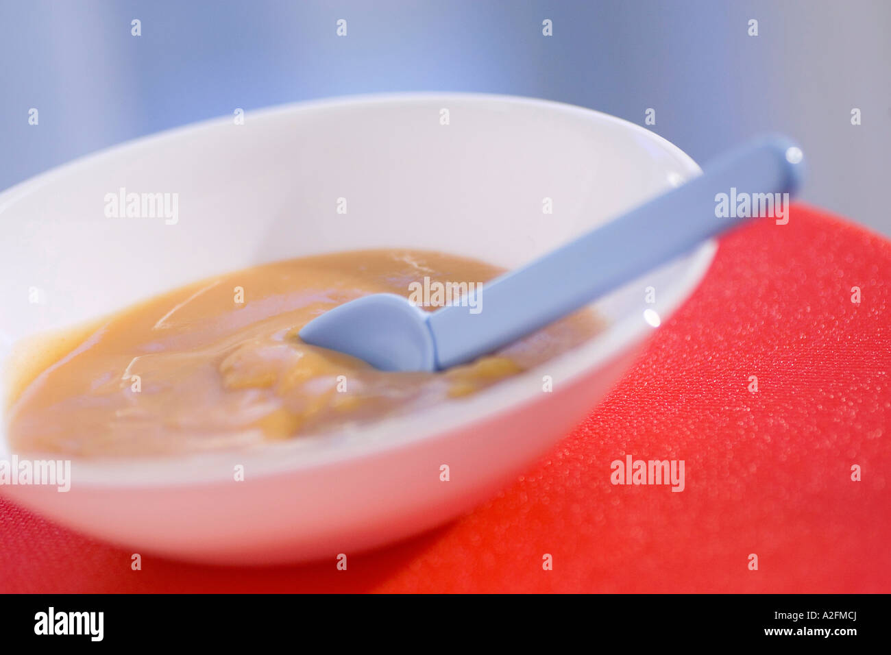 Bowl with plastic spoon and pap Stock Photo - Alamy