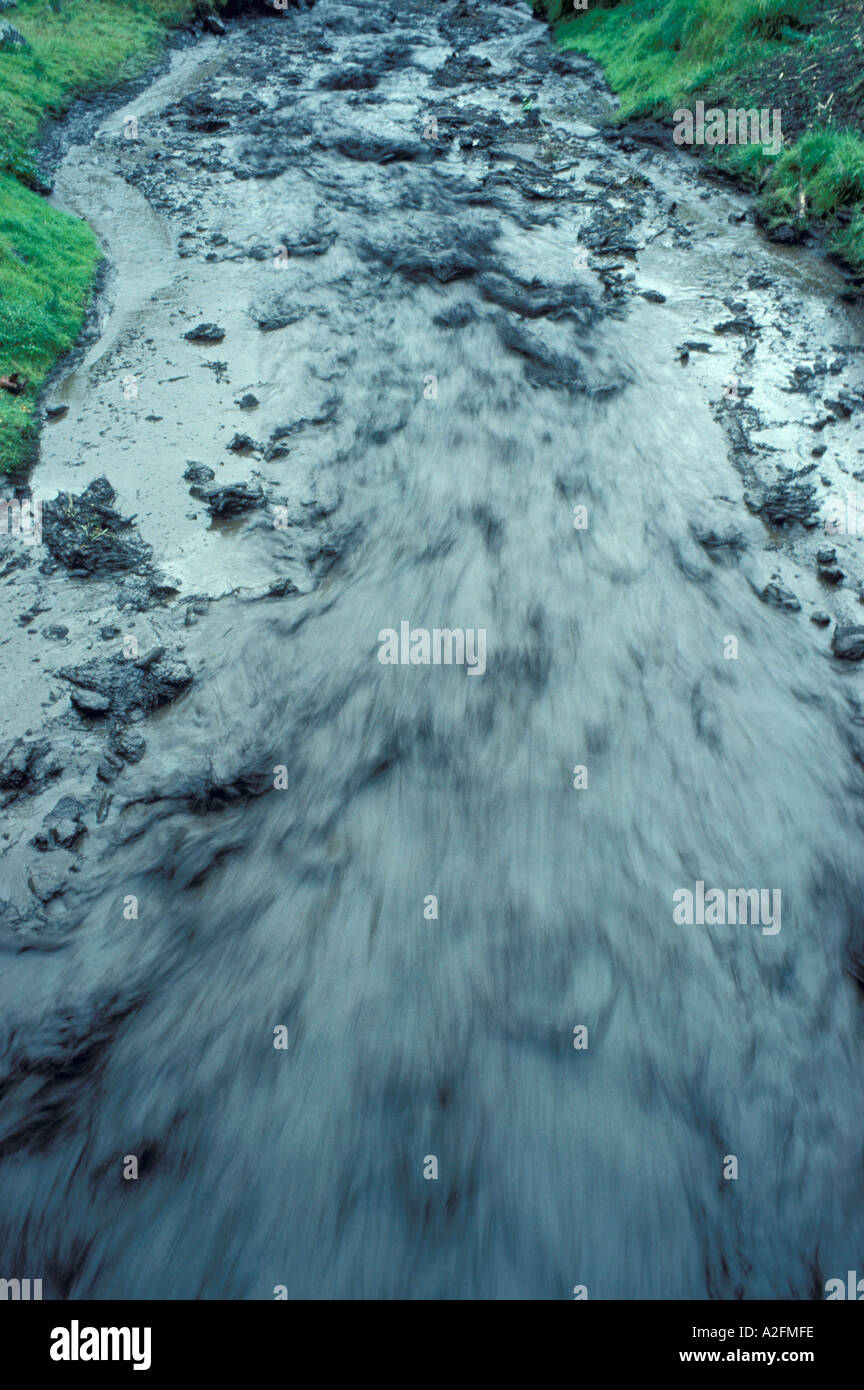 Flooding River fast flowing mud water Banos Ecuador South America Stock ...