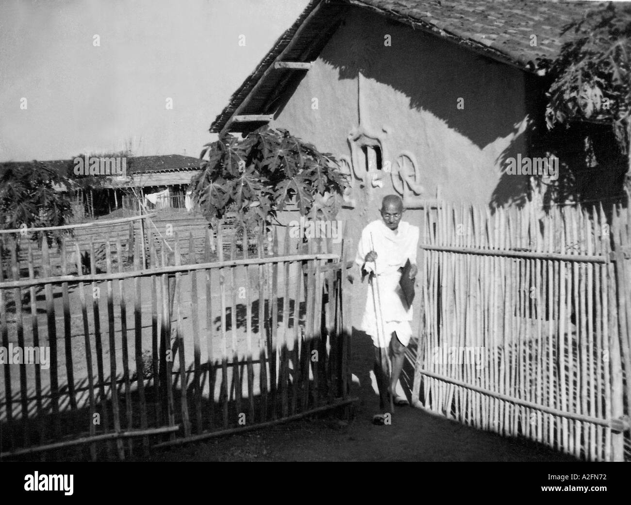 Mahatma Gandhi in front of his hut in Sevagram Ashram at Wardha Vardah ...