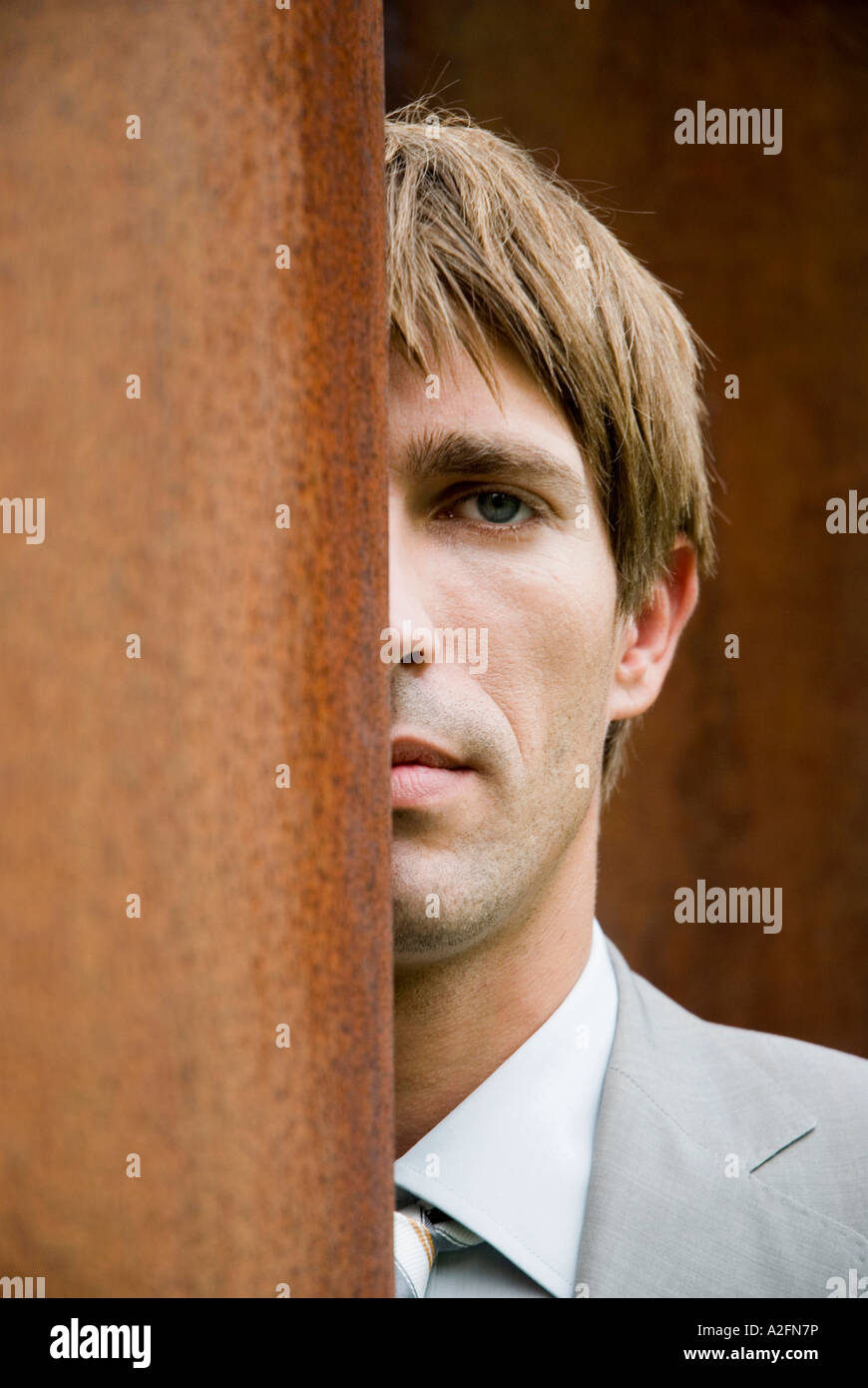 Young man against wooden planking, portrait Stock Photo - Alamy