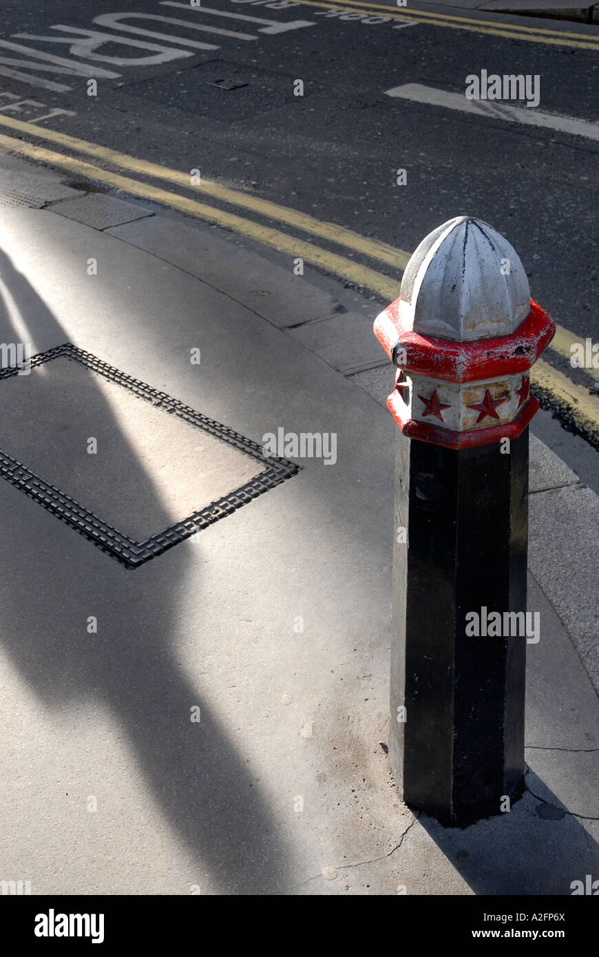 Street bollard and shadow in the City of London Stock Photo - Alamy