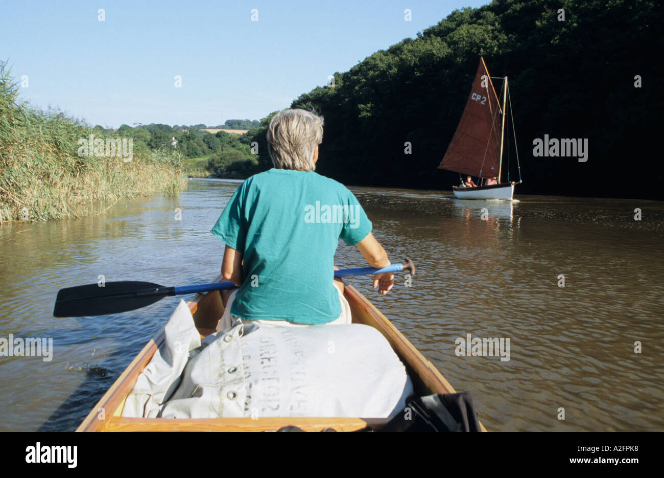 Traditional sloop on the Tamar nr cALSTOCK cORNWALL Viewed from canoe ...