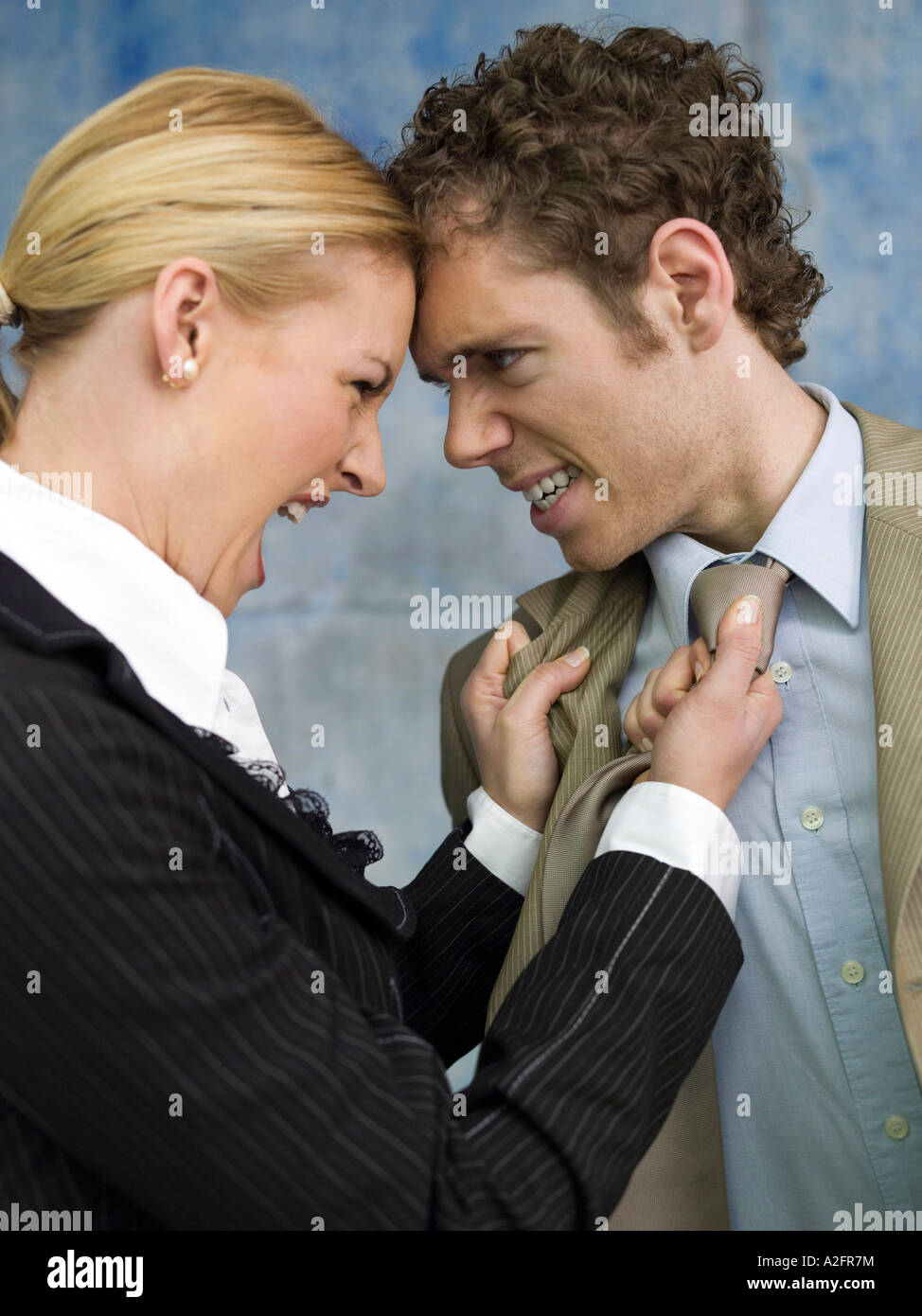 Man woman grabbing tie hi-res stock photography and images - Alamy