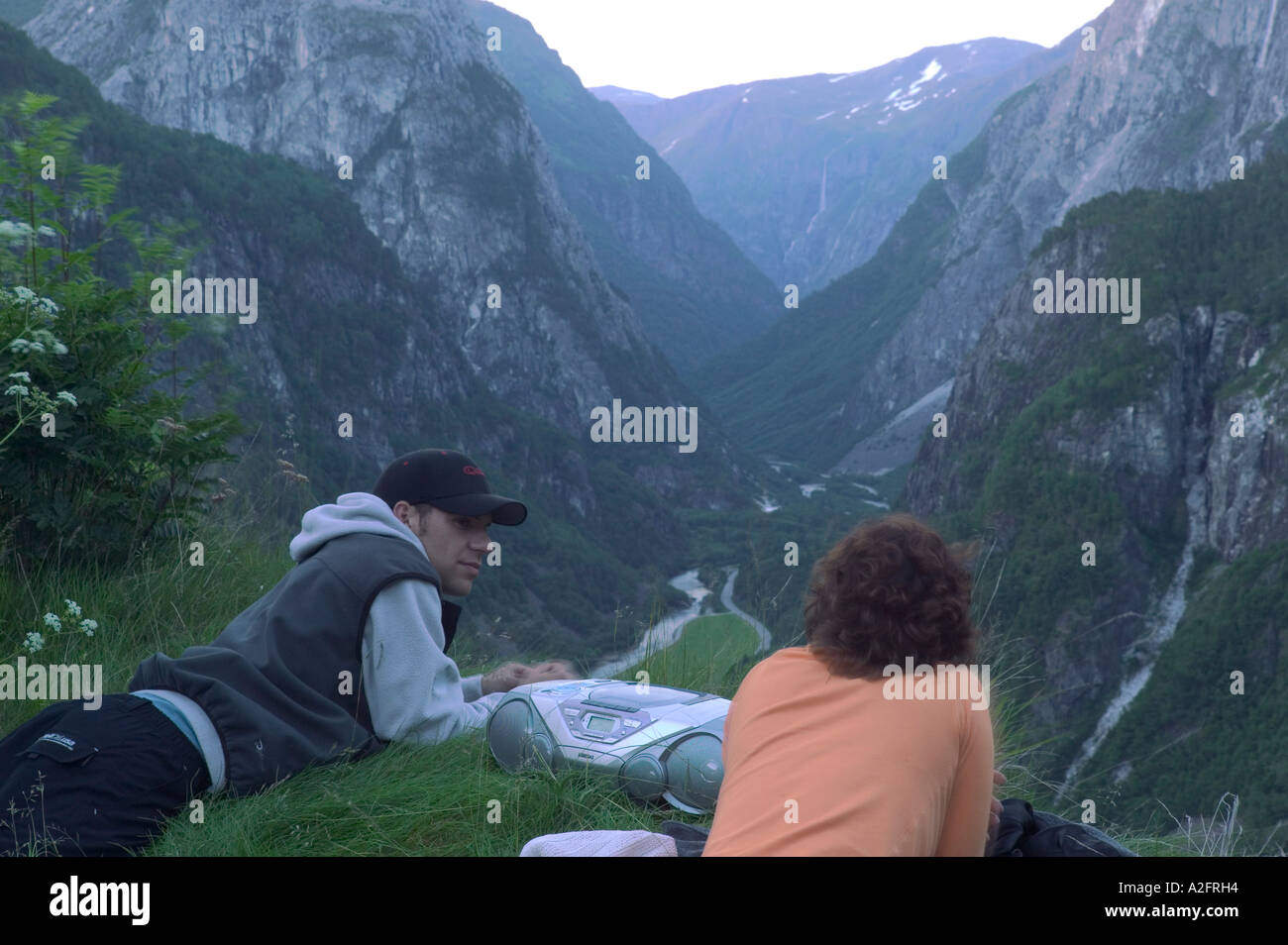 Couple enjoys view of deep valley between Sogne Fjord and Hardanger ...