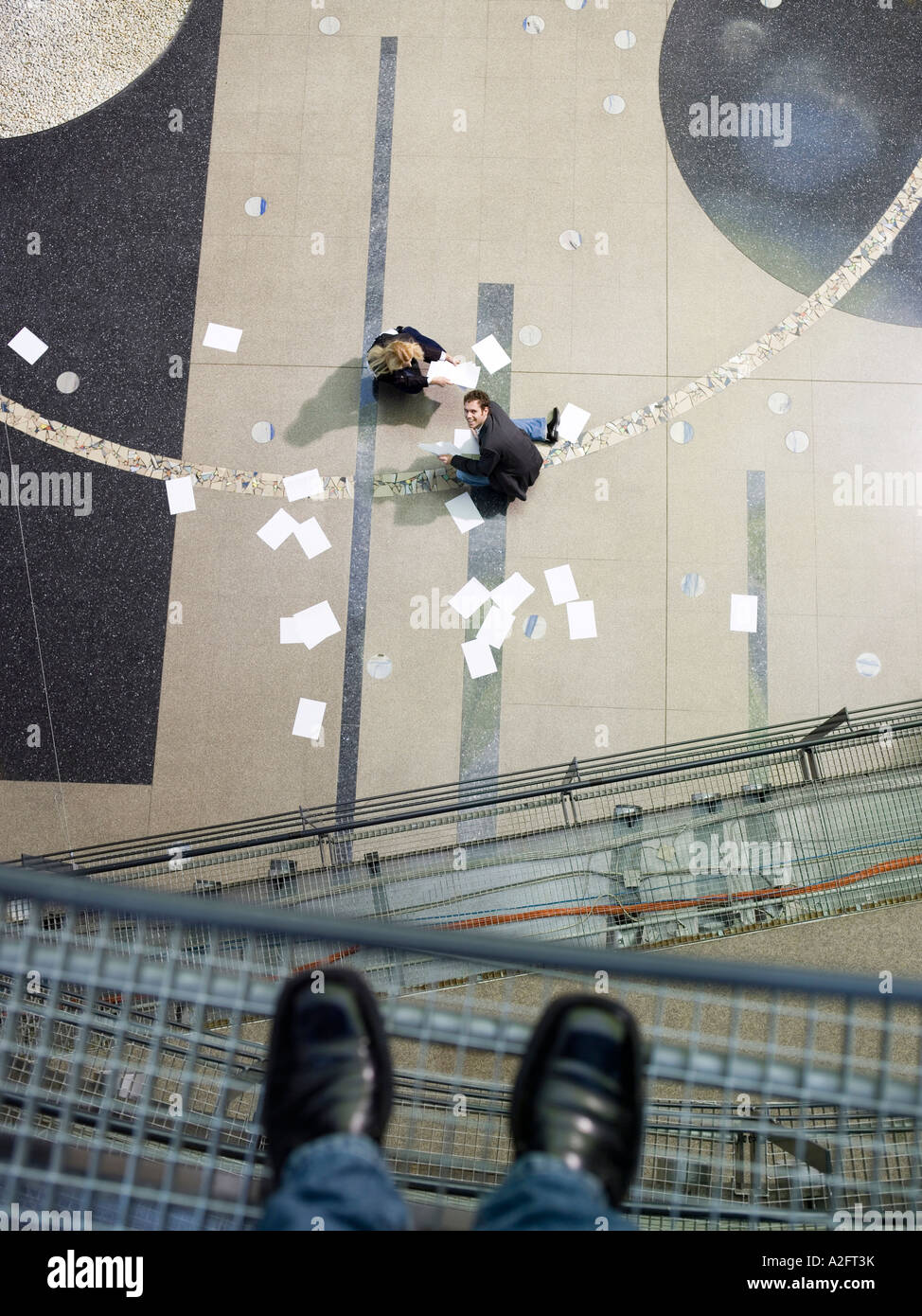 Woman picking up papers hi-res stock photography and images - Alamy