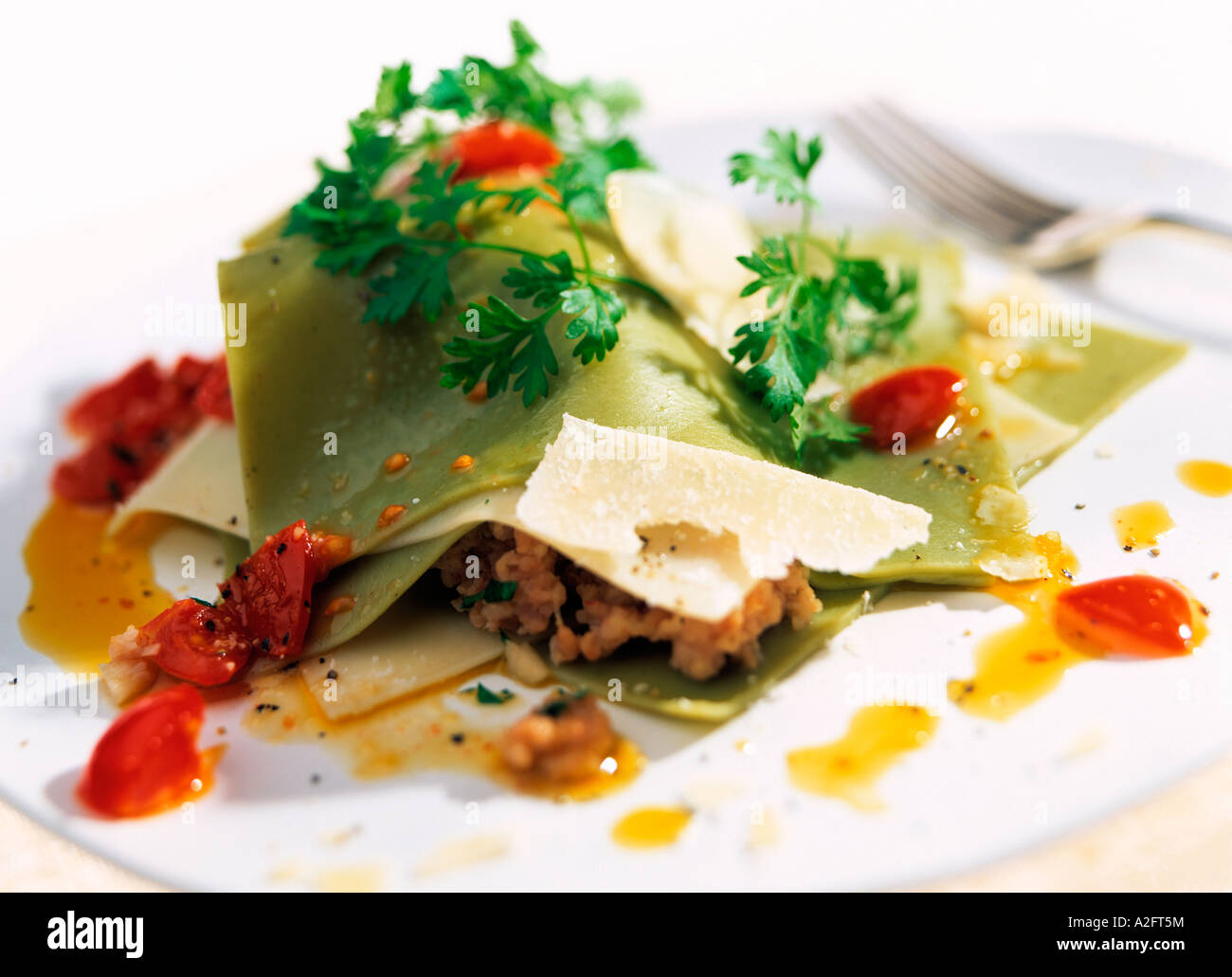 Open ravioli on a white background Stock Photo - Alamy