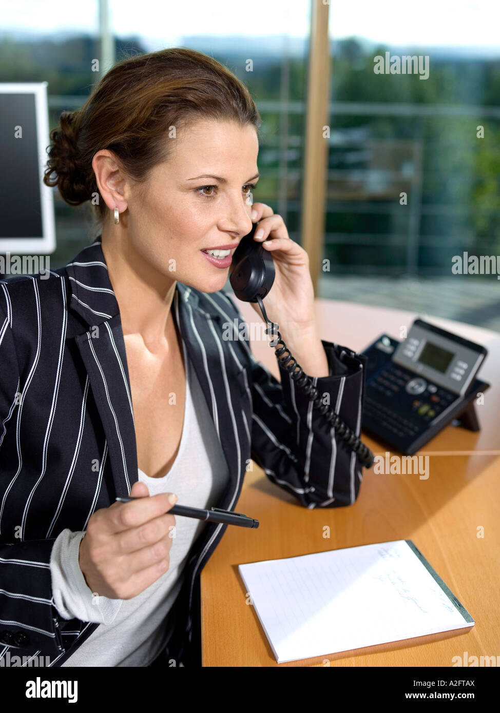 Businesswoman in office Stock Photo - Alamy