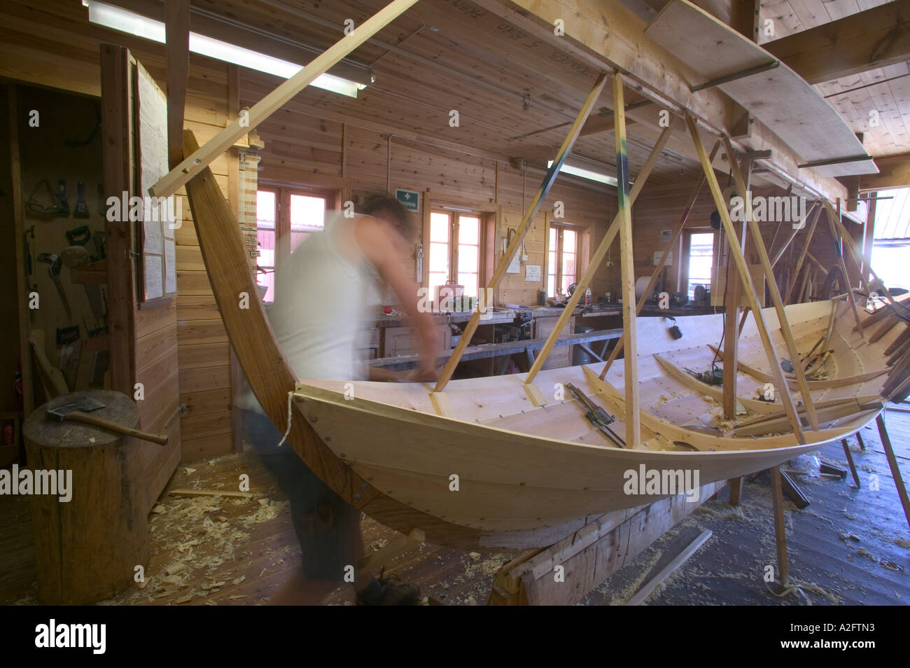 A traditional lapstrake rowboat being built with traditional ...
