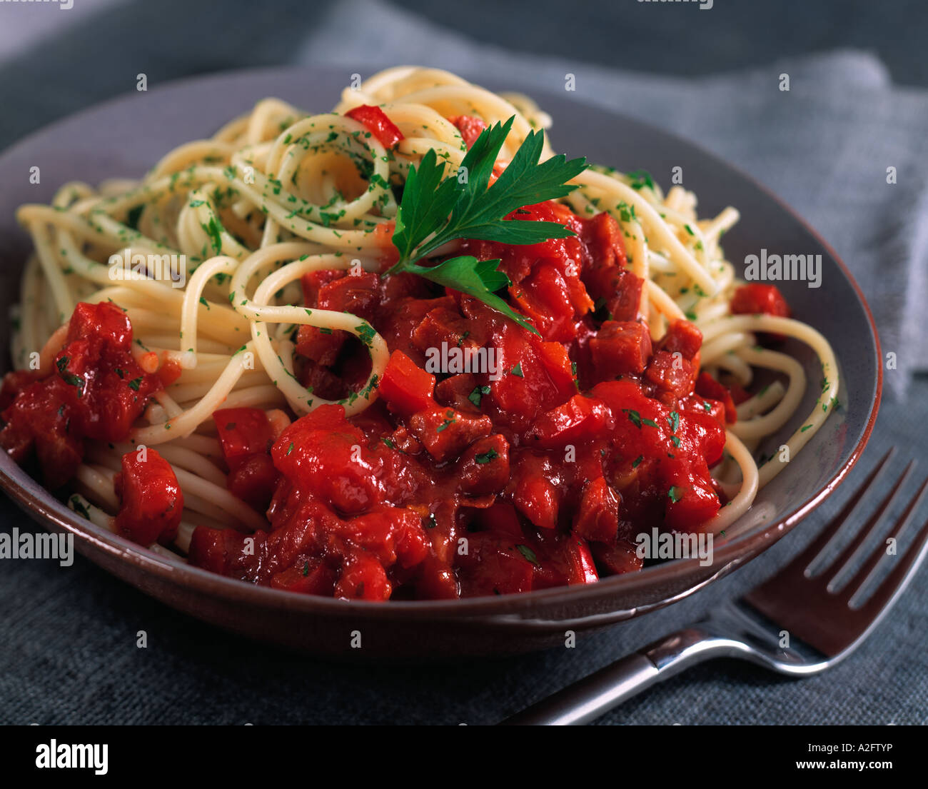 A plate of spaghetti and red peppers Stock Photo - Alamy