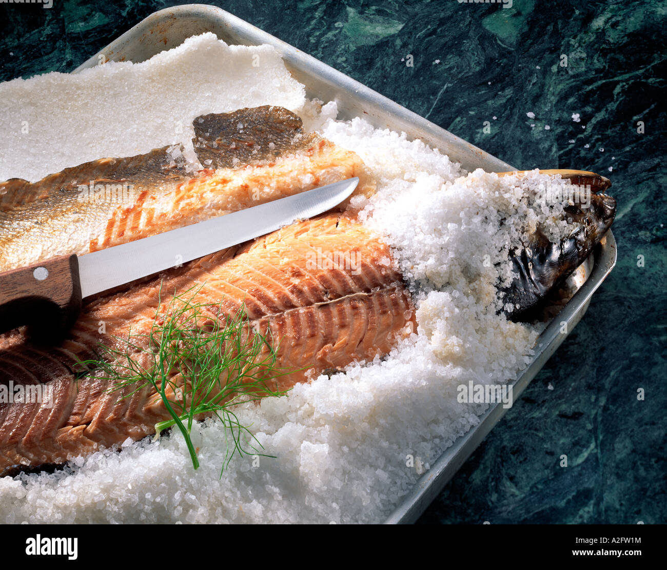 Salting a salmon Stock Photo - Alamy