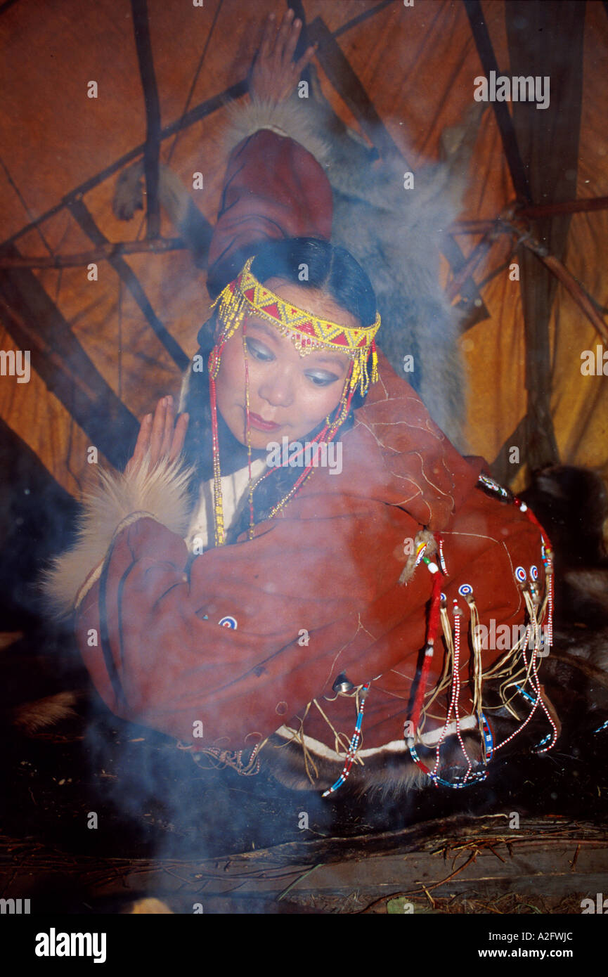 ASIA, Russia, Kamchatka Native woman posing in traditional dress by the ...