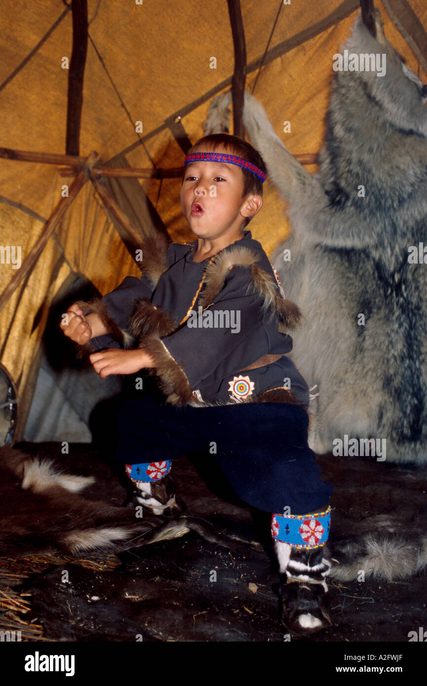 ASIA, Russia, Kamchatka Young native boy in warrior pose wearing ...