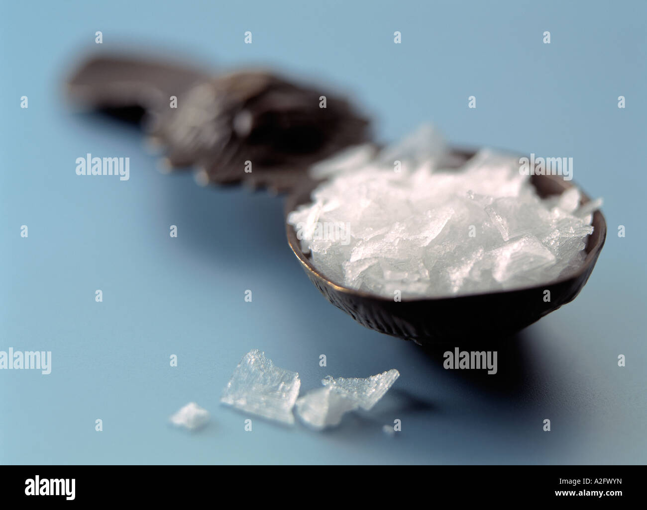 A wooden spoon of rock salt crystals Stock Photo - Alamy