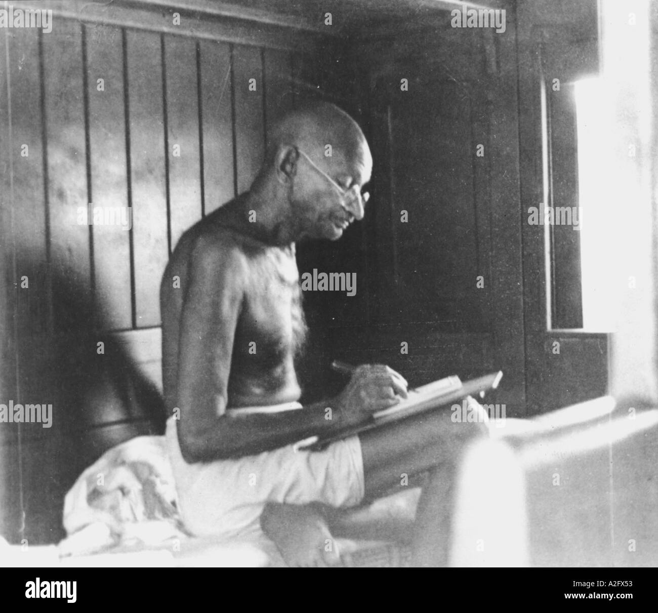 MKG33110 Mahatma Gandhi at work on the train to Simla Himachal Pradesh ...