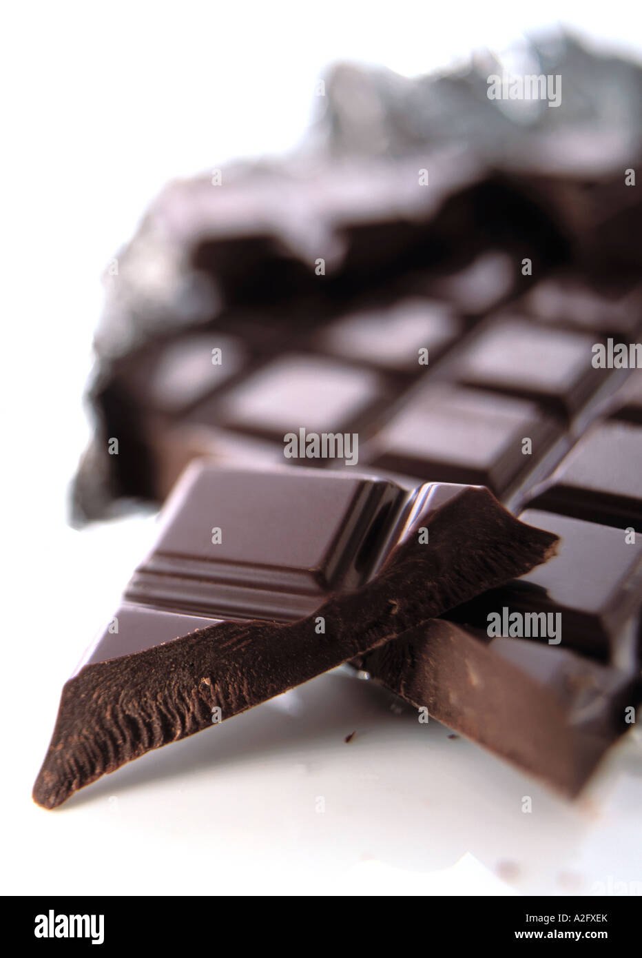 Plain dark chocolate close up on a white background Stock Photo - Alamy