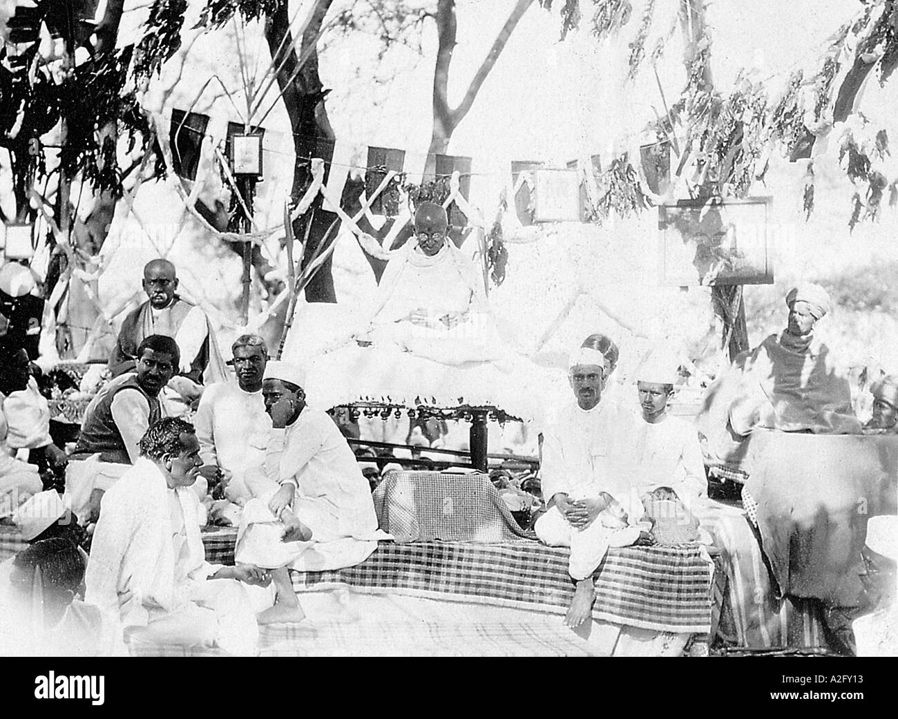 Mahatma Gandhi plying his takli spindle at a public meeting India 1929 ...