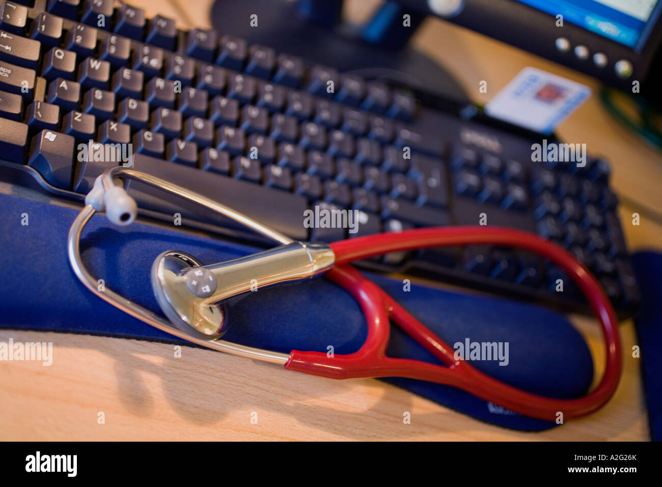 Medical doctors desk with computer keyboard and stethoscope general ...