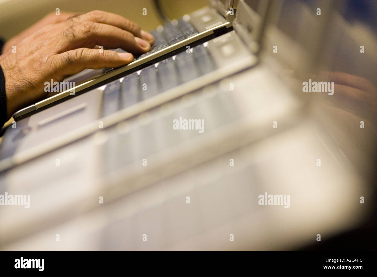 Laptops in a line with one being worked on Stock Photo - Alamy