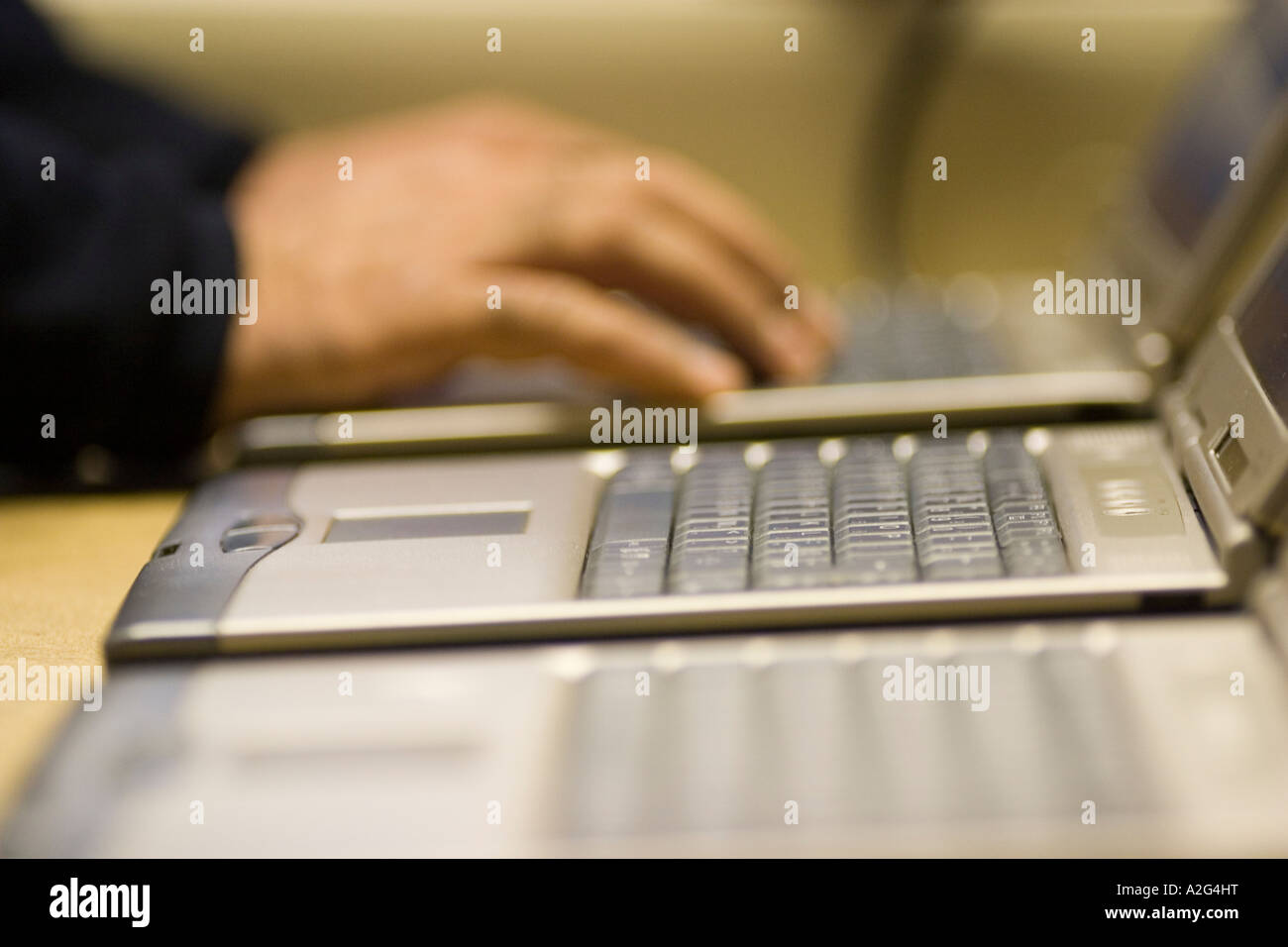Laptops in a line with one being worked on Stock Photo - Alamy